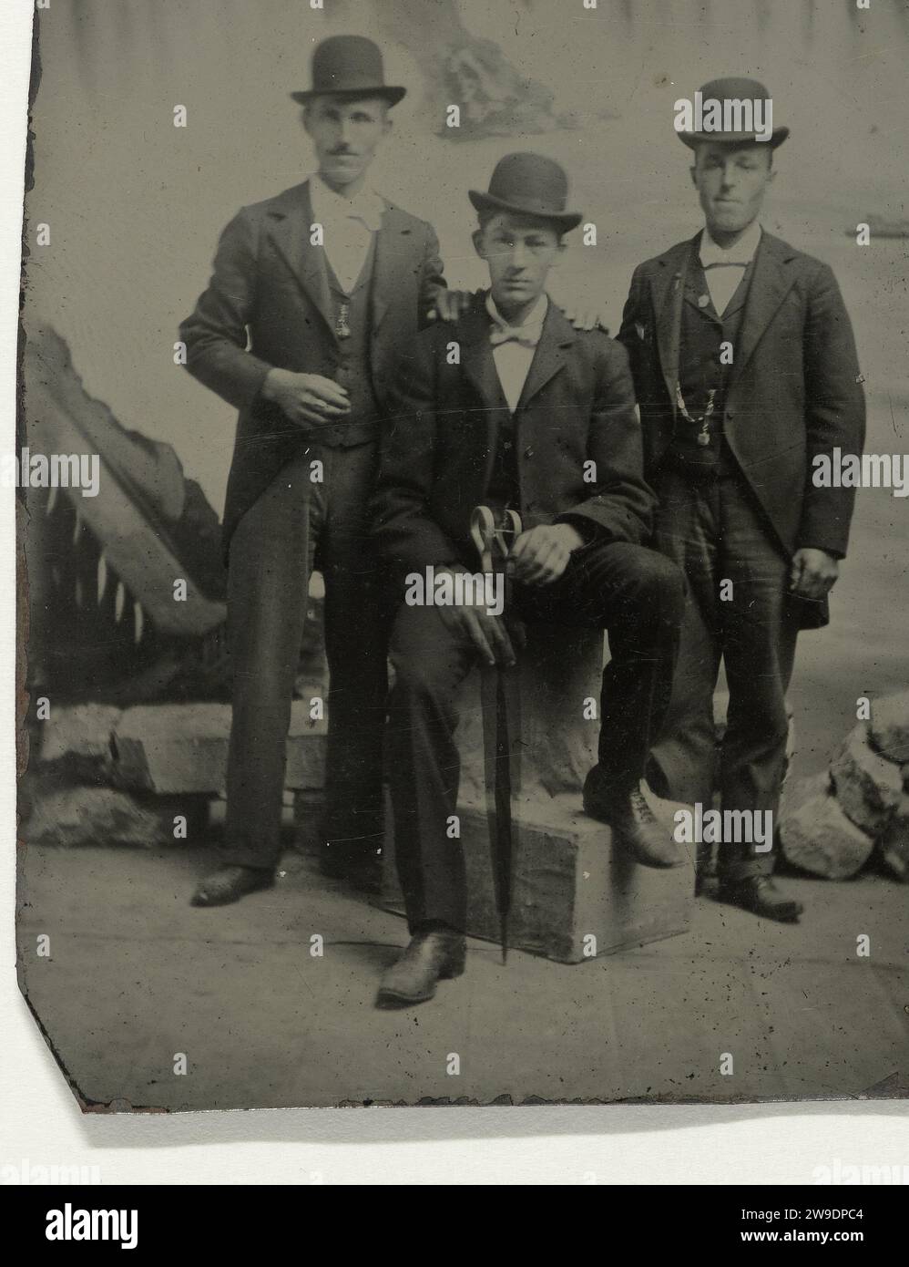 Portrait of three men for a painted background cloth with the Niagara ...