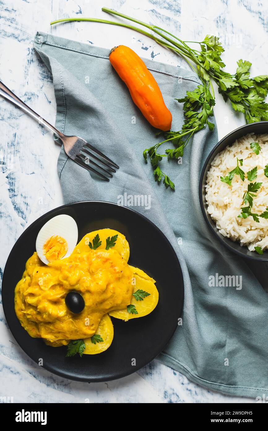 Traditional dish called aji de gallina with a portion of rice ...