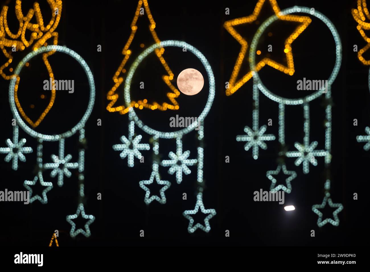 The full moon of December, known as the 'cold moon', is seen on the sky ...