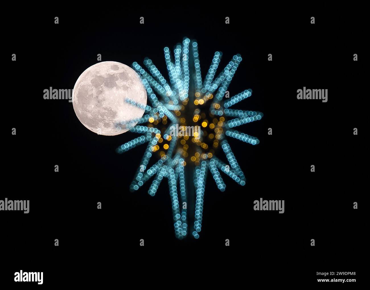The full moon of December, known as the 'cold moon', is seen on the sky ...