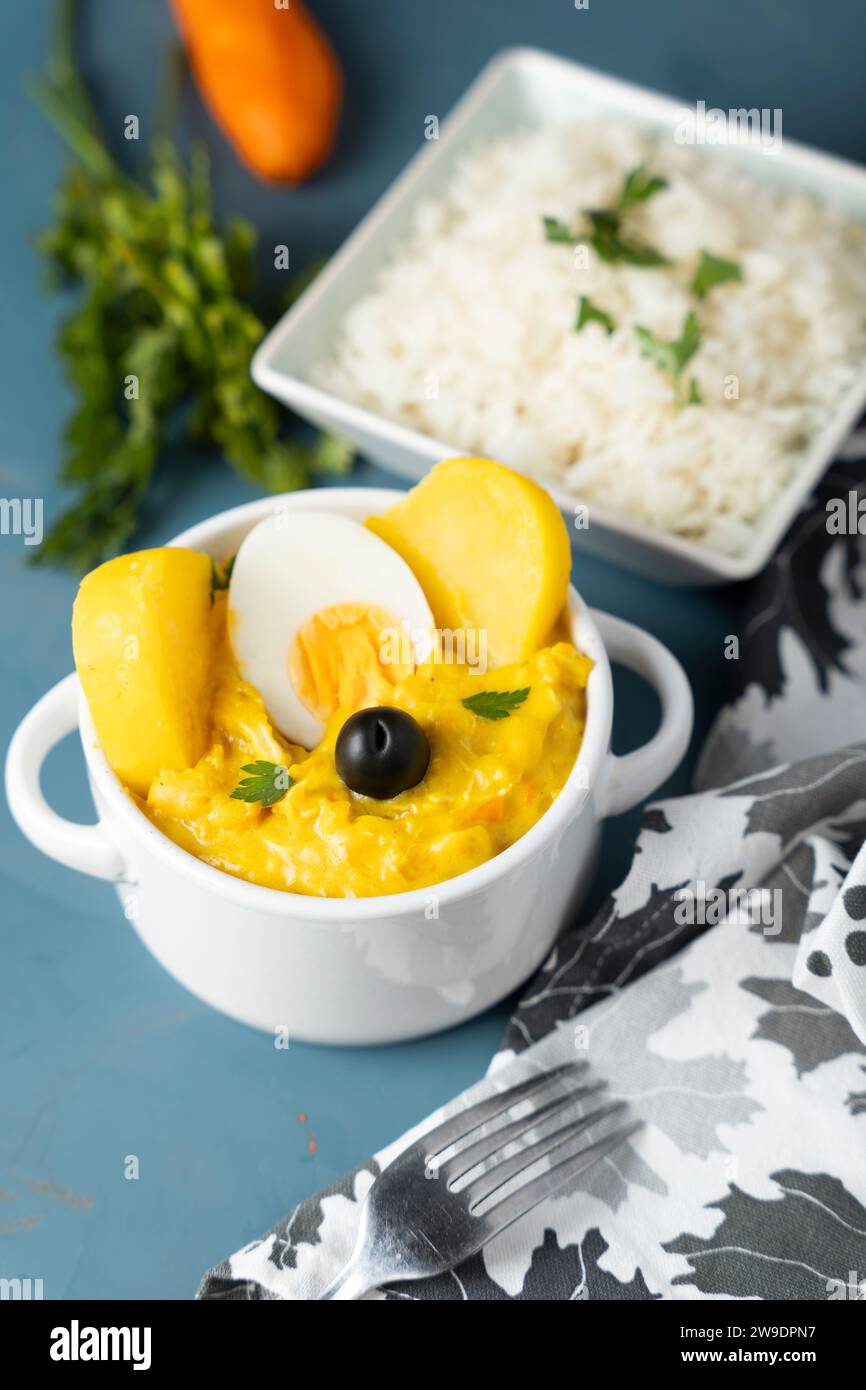 Traditional dish called aji de gallina with a portion of rice, very ...