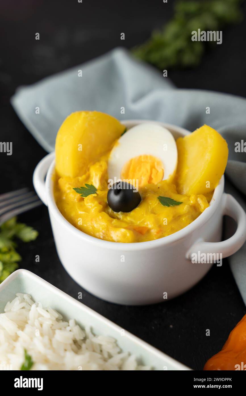 Typical Peruvian dish called Ají de gallina in dark food Stock Photo ...