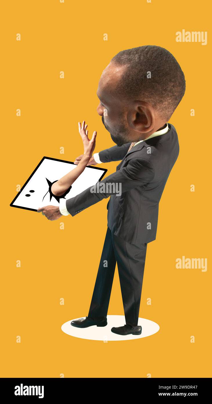 Young man holding table with hand sticking out. Social media addiction ...