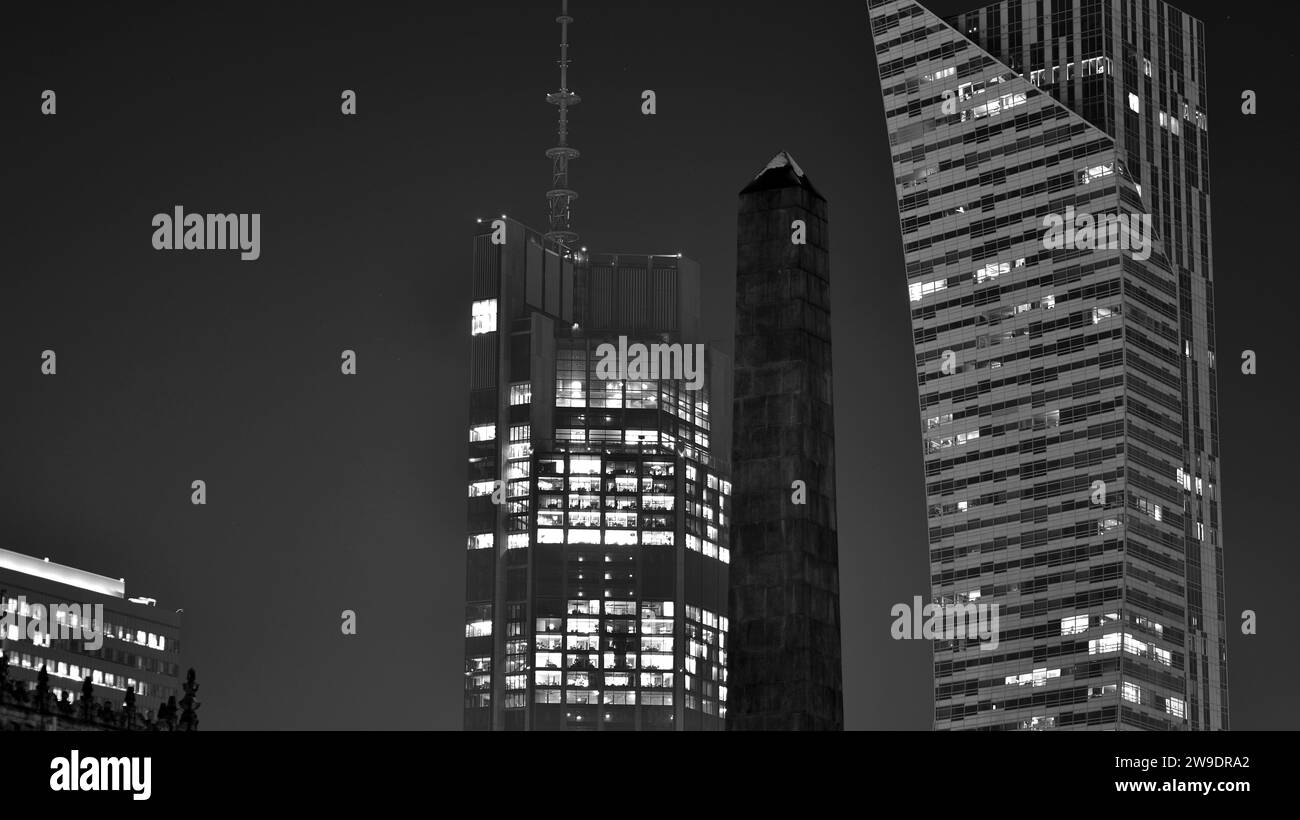 Pattern of office buildings windows illuminated at night. Glass ...