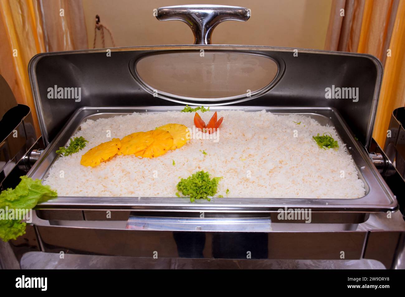 white rice with colorful vegetables as a salad on buffet. colorful ...