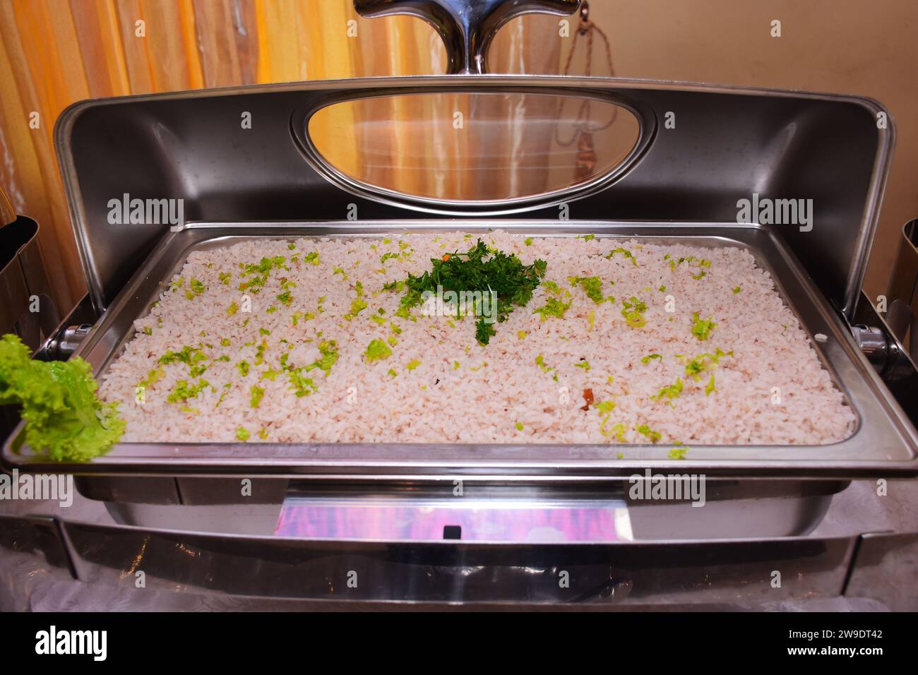 red rice with colorful vegetables as a salad on buffet. colorful ...