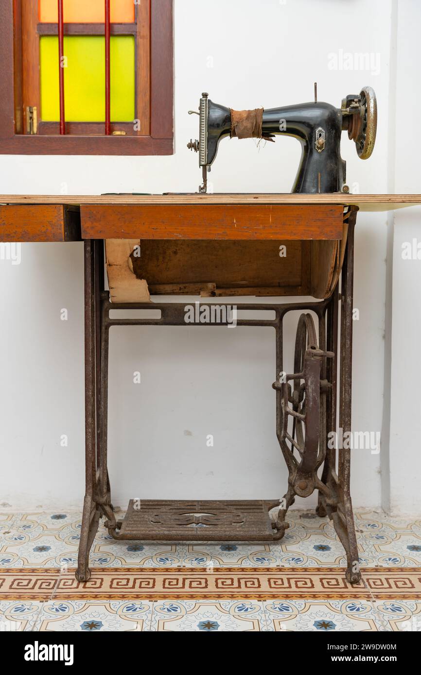 old-fashioned sewing machine at vertical composition Stock Photo - Alamy