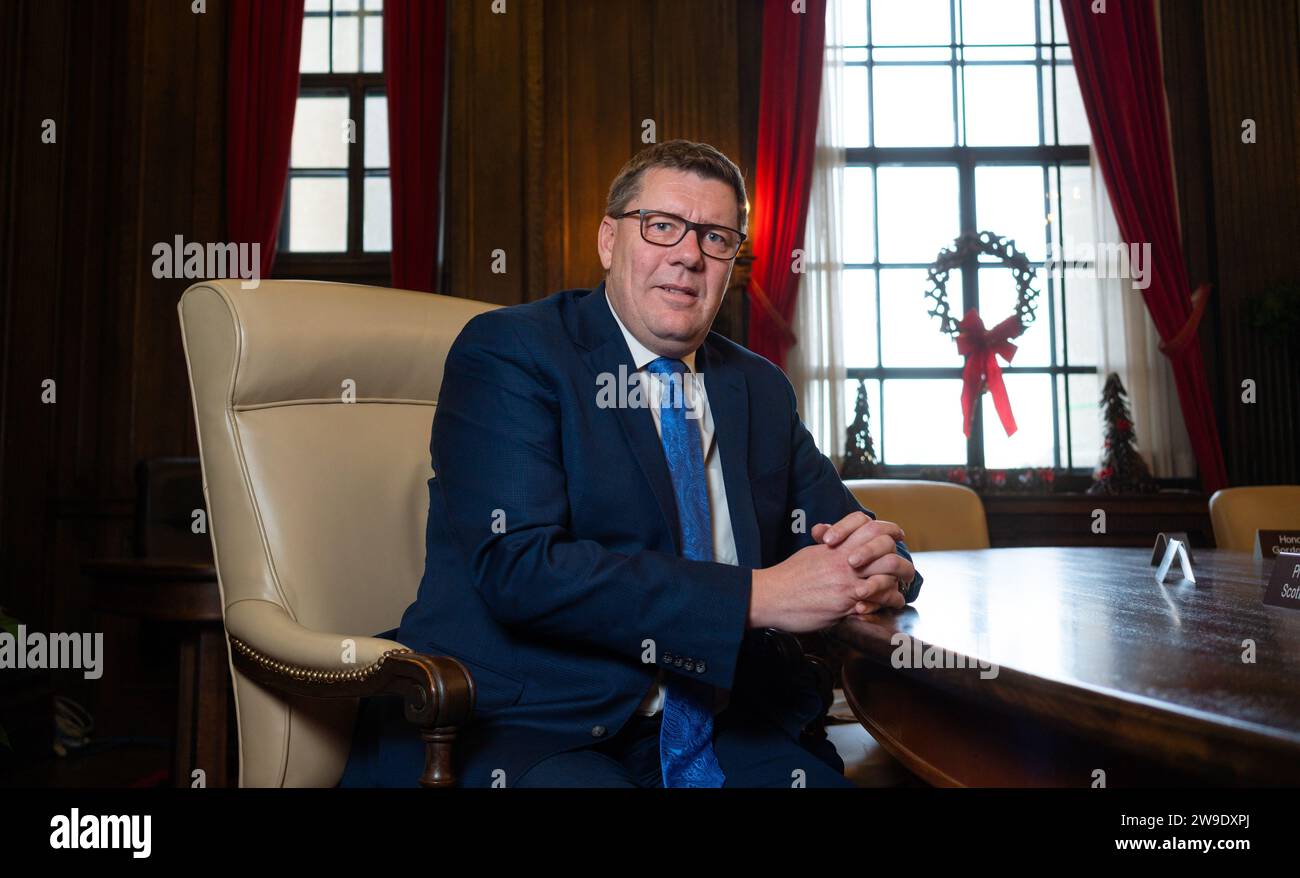 Regina, Canada. 18th Dec, 2023. Saskatchewan Premier Scott Moe sits for ...