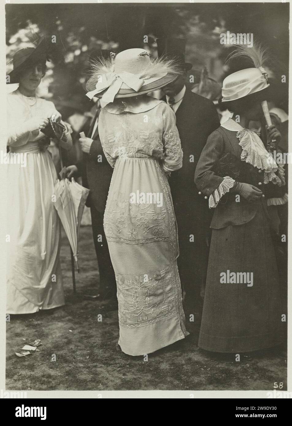 Three ladies at the Hippodrome de Longchamp during horse races in the ...
