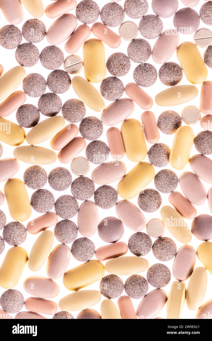 Pastel coloured pills and tablets background Stock Photo - Alamy