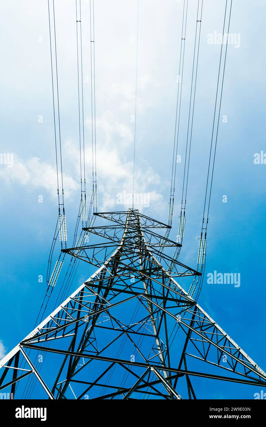 Electricity pylon against a blue sky, London, UK Stock Photo - Alamy