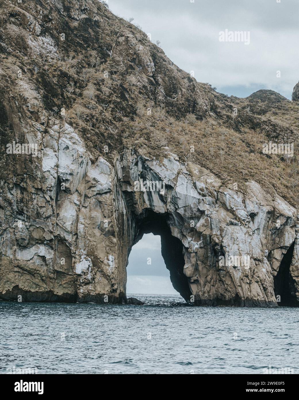 Natural rock arch at Punta Pitt, Galapagos Islands, Ecuador, showcasing ...