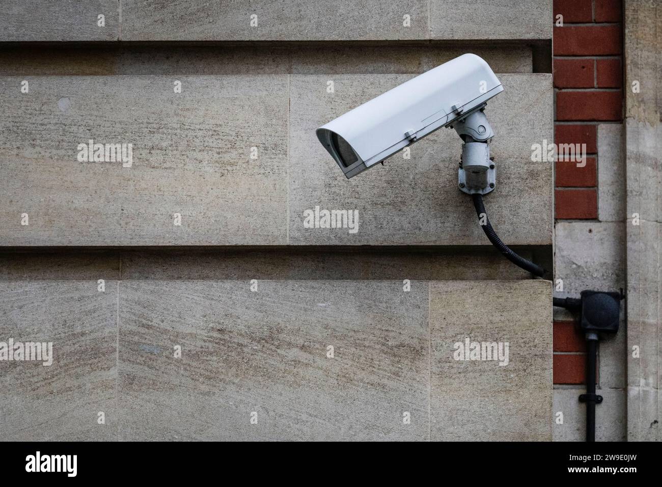 CCTV camera on wall in street, SW1 City of Westminster, London, England ...