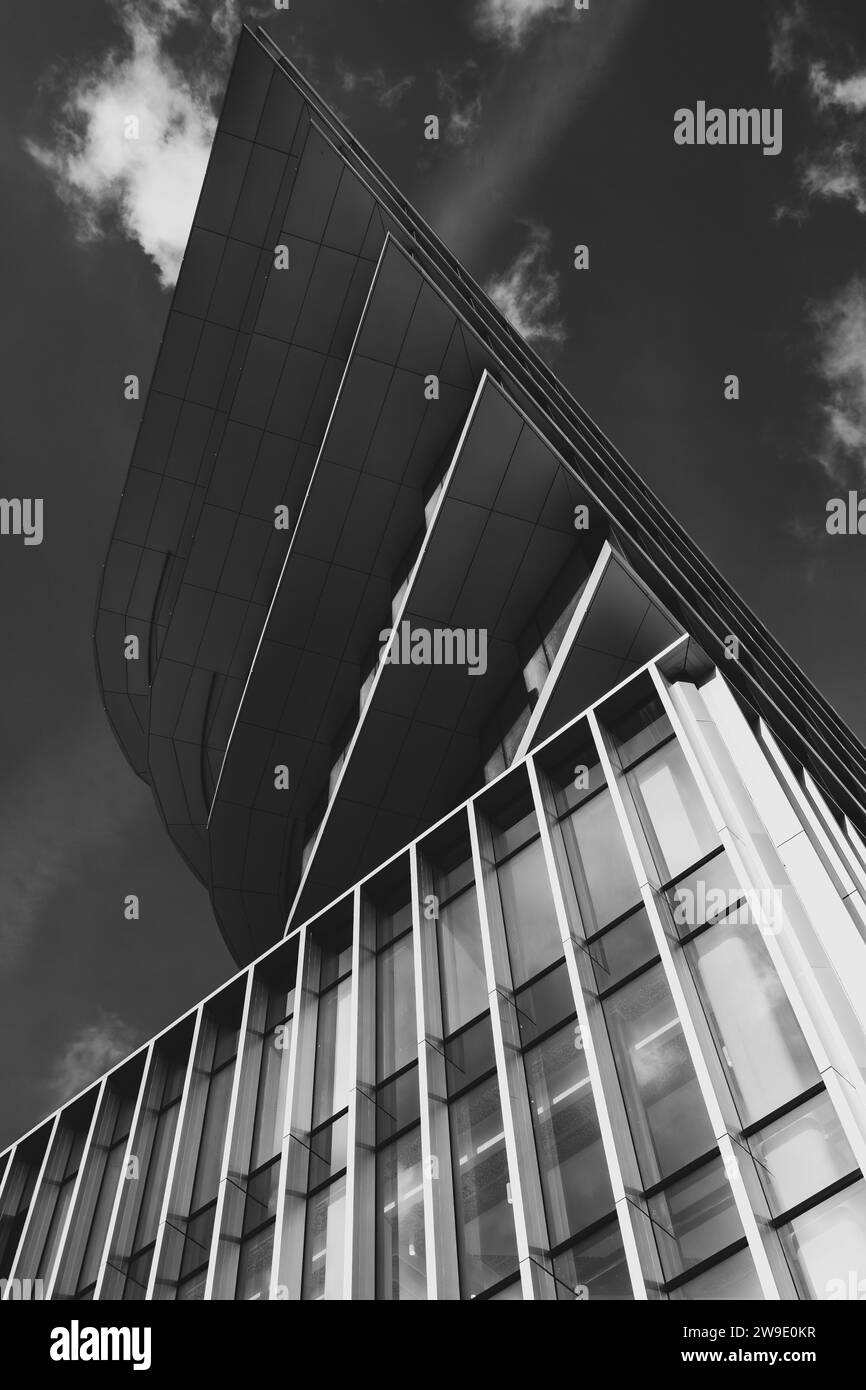 From below dramatic black and white capture of a modern building's ...