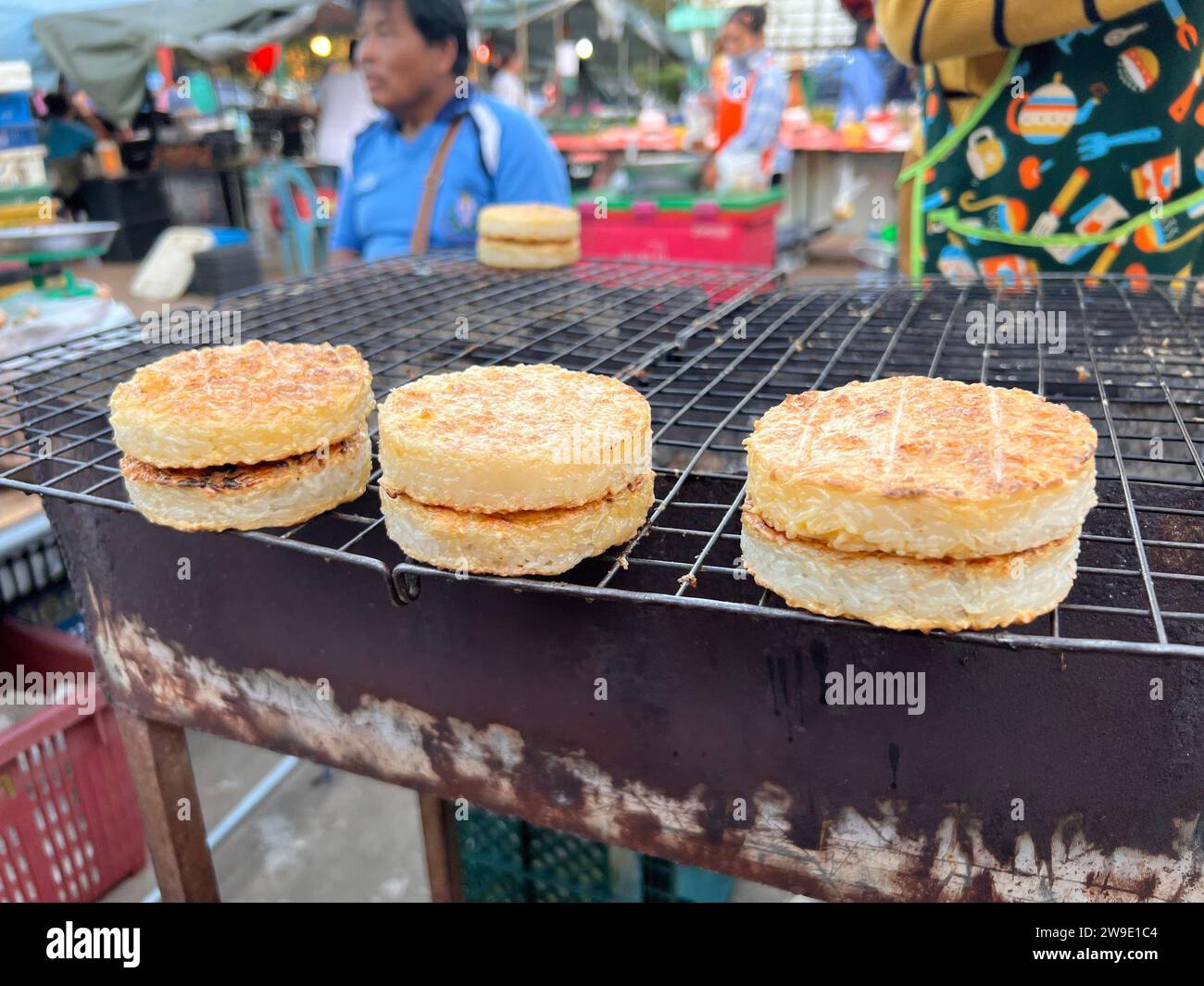 Grilled sticky rice dipped in egg Sticky rice , street Thai food winter ...