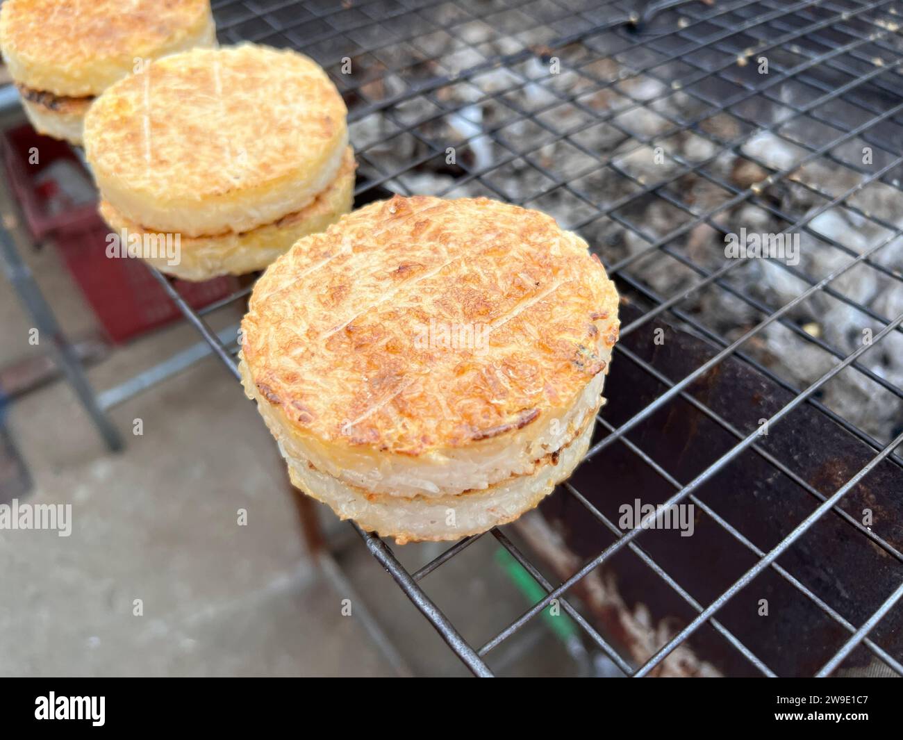 Grilled sticky rice dipped in egg Sticky rice , street Thai food winter ...