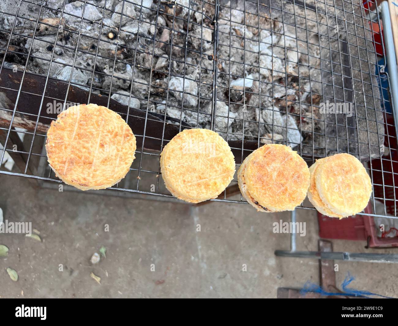 Grilled sticky rice dipped in egg Sticky rice , street Thai food winter ...