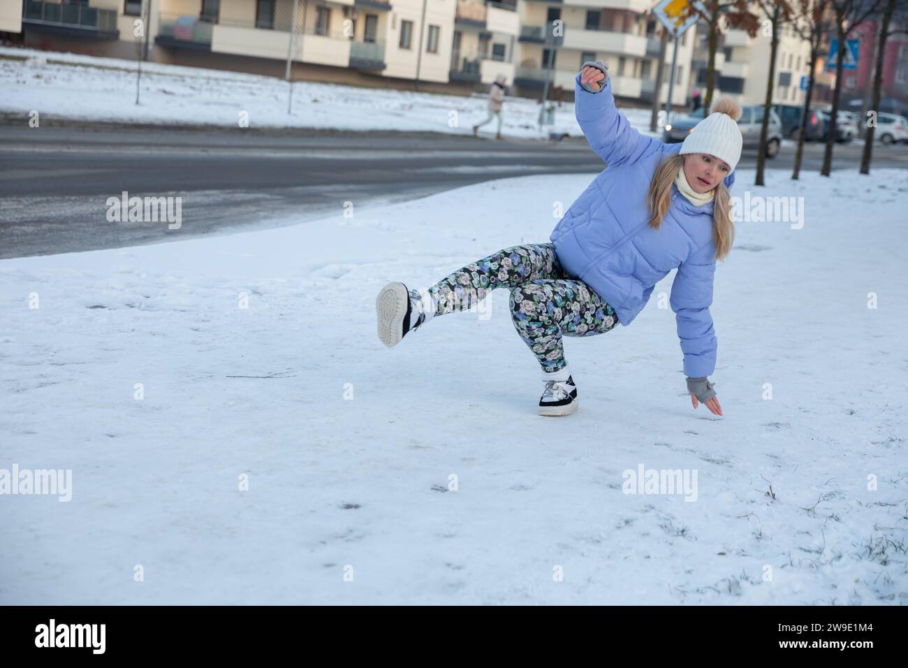 The woman stumbled while walking and falls backwards Stock Photo - Alamy