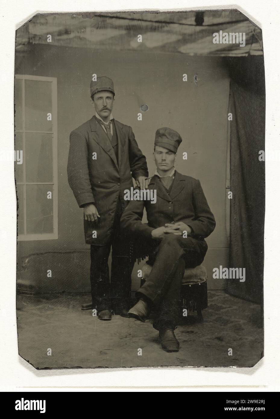 Portrait of two men in a studio for a painted background cloth, c. 1880 ...