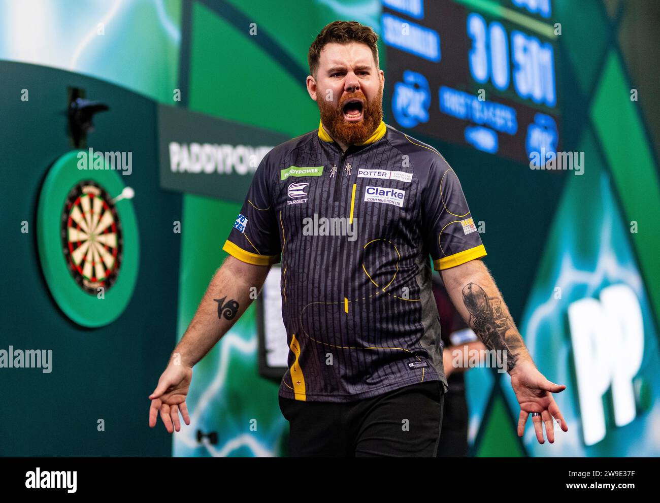 Scott Williams celebrates after winning his match against Martin ...