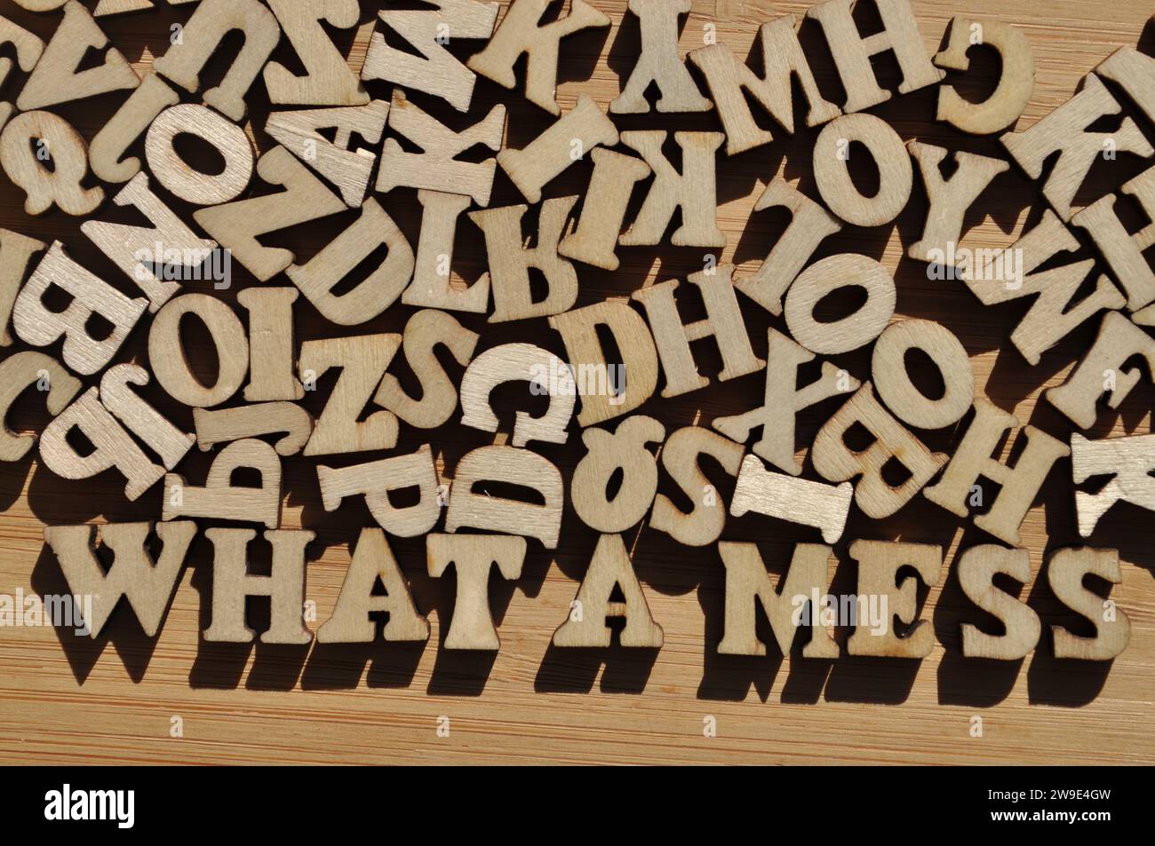 What A Mess, words in wooden alphabet letters surrounded by random ...