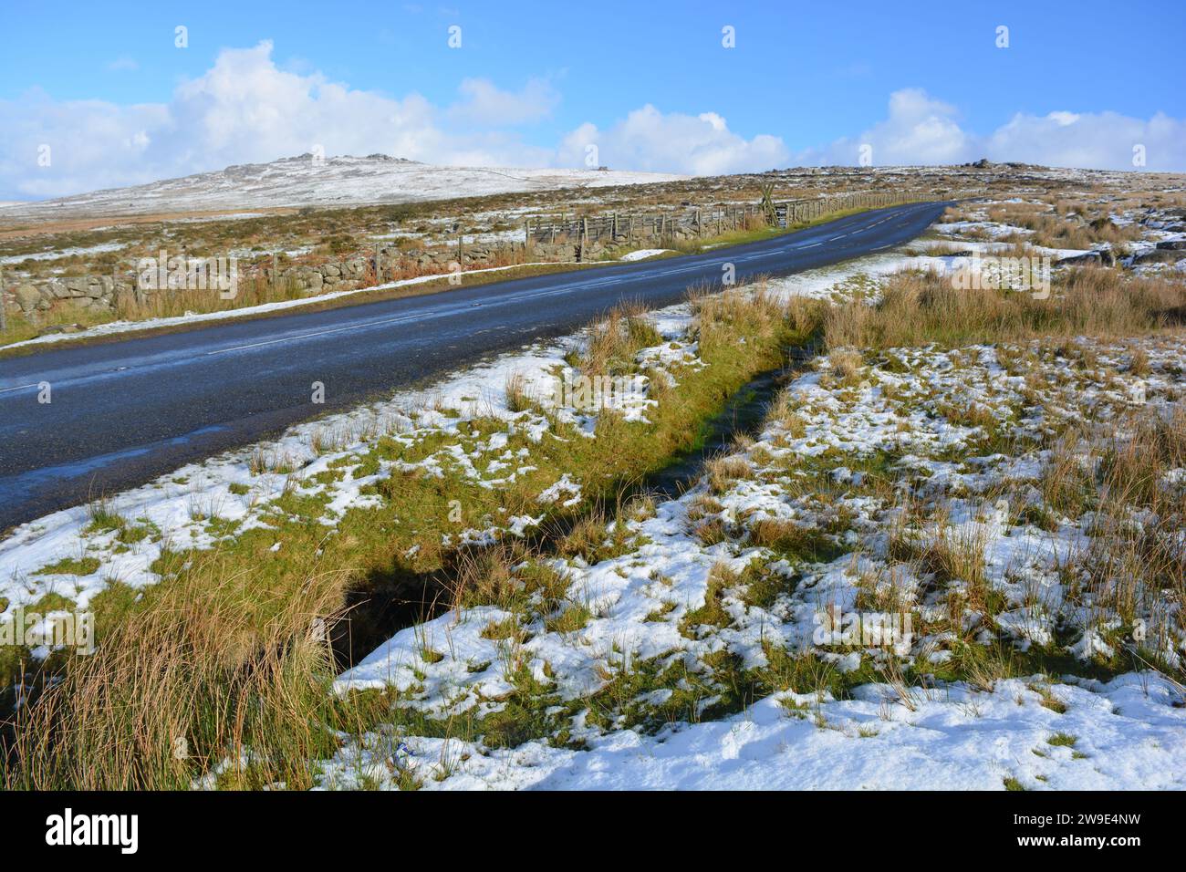 Road across the moors, looking towards a tor on the horizon, Dartmoor ...