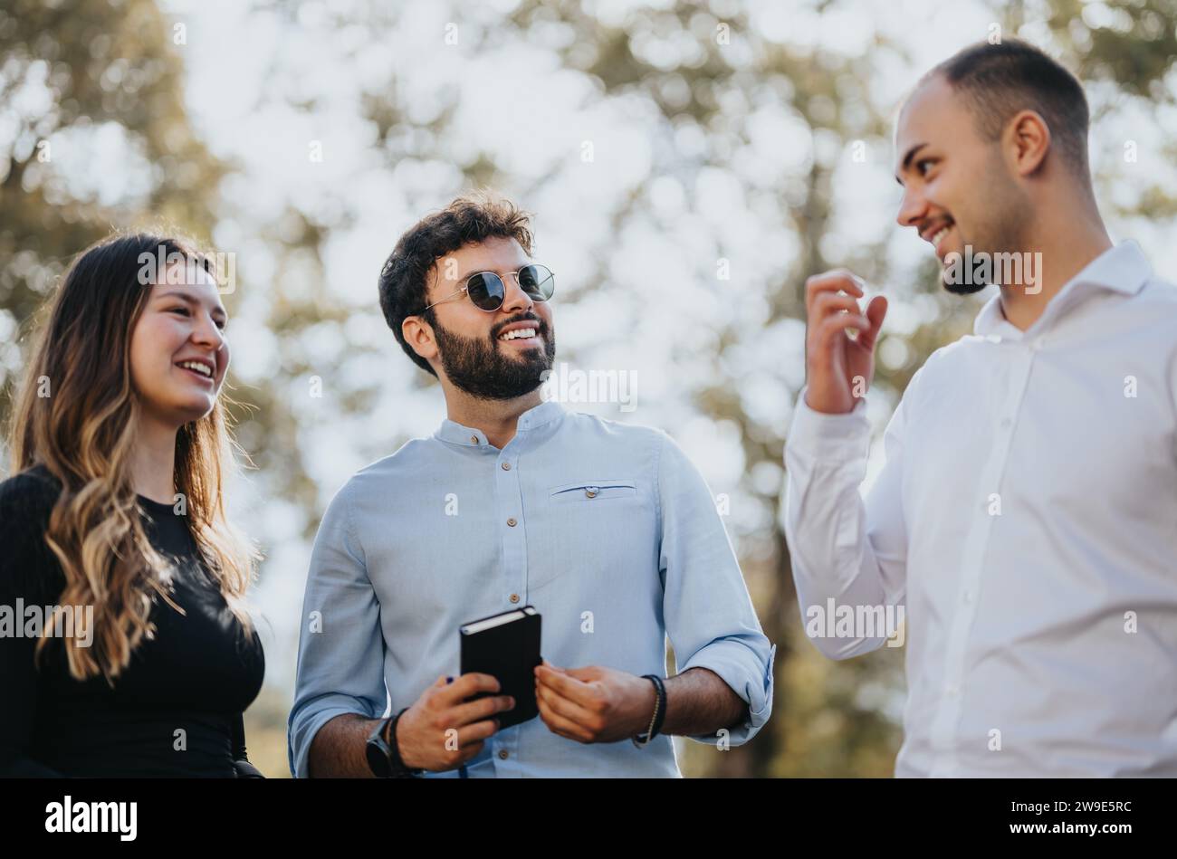 Students achieving goals together, collaborating in a park. Discussing ...