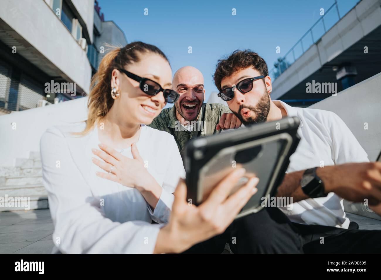 Successful Urban Business Partners Discussing Project Details Outdoors ...