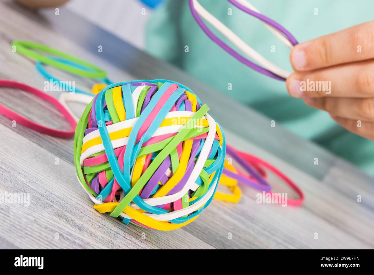 Ball of colorful rubber bands or erasers. Development of kids motor ...