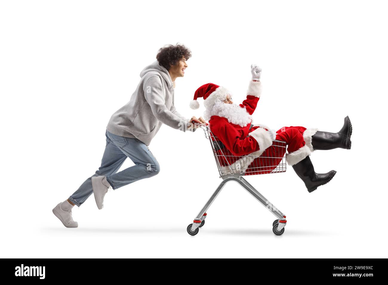Guy running and pushing Santa Claus in a shopping cart isolated on ...