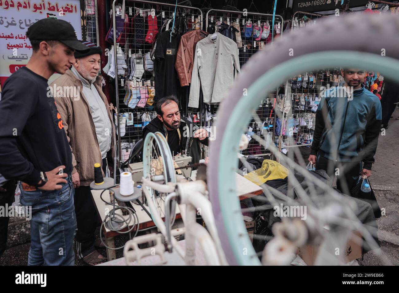 A Palestinian tailor named Abu Adam Dolah, uses a pedaled sewing ...