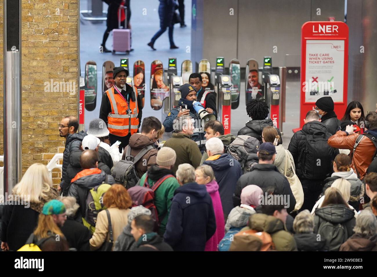 Passengers at King's Cross station in London. Problems with two ...