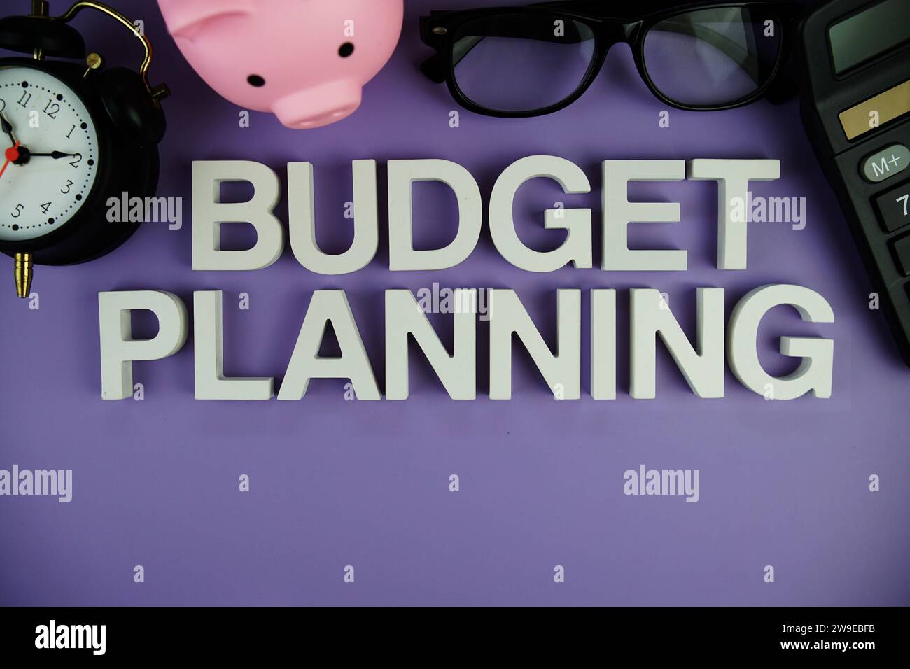 Budget Planning alphabet letters with piggy bank, alarm clock ...