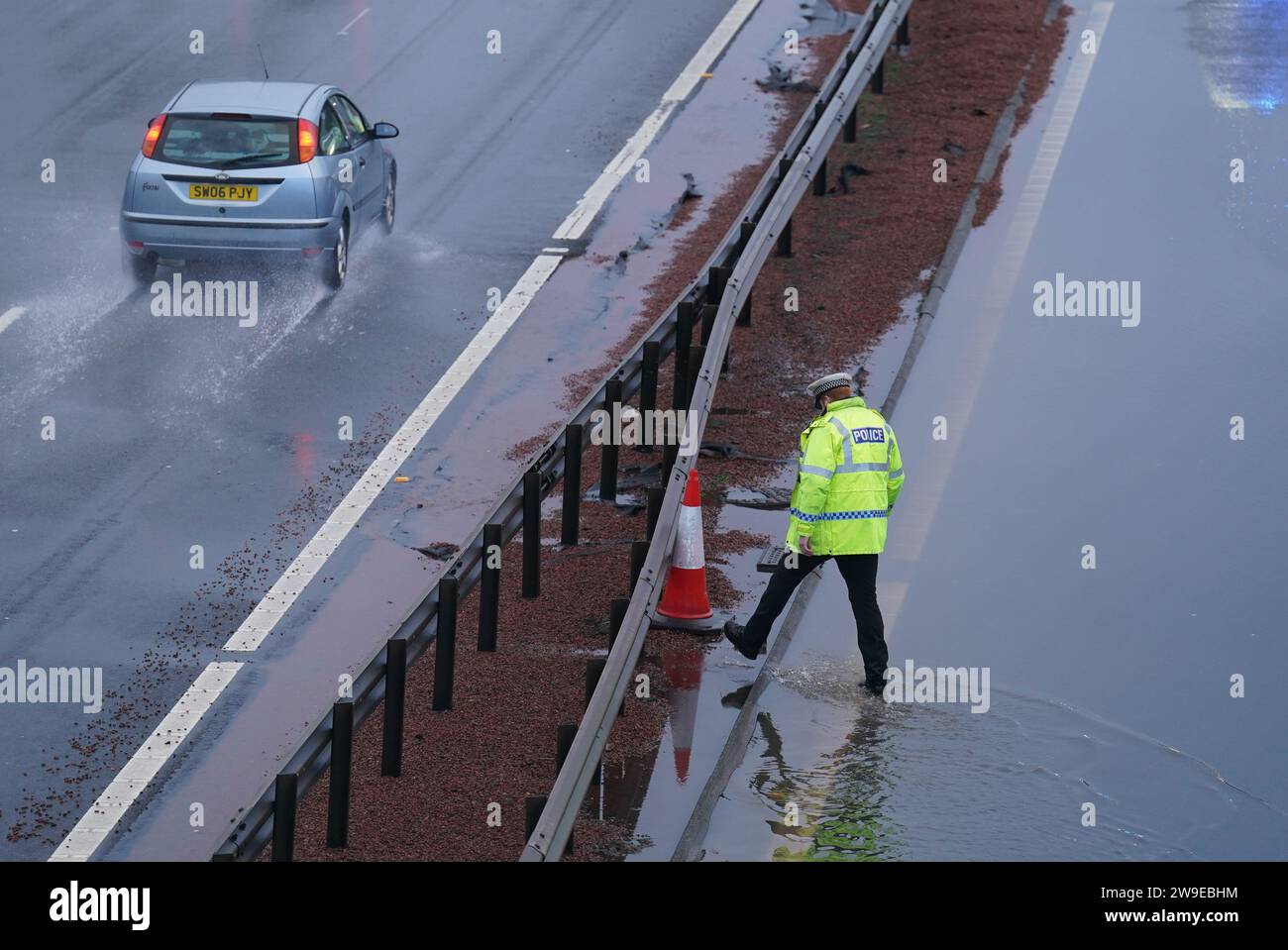 Police are in attendance as flood water is cleared from the M9 at ...