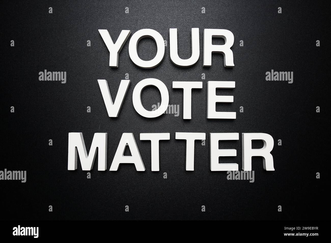 Your Vote Matters alphabet letter on black background Stock Photo - Alamy