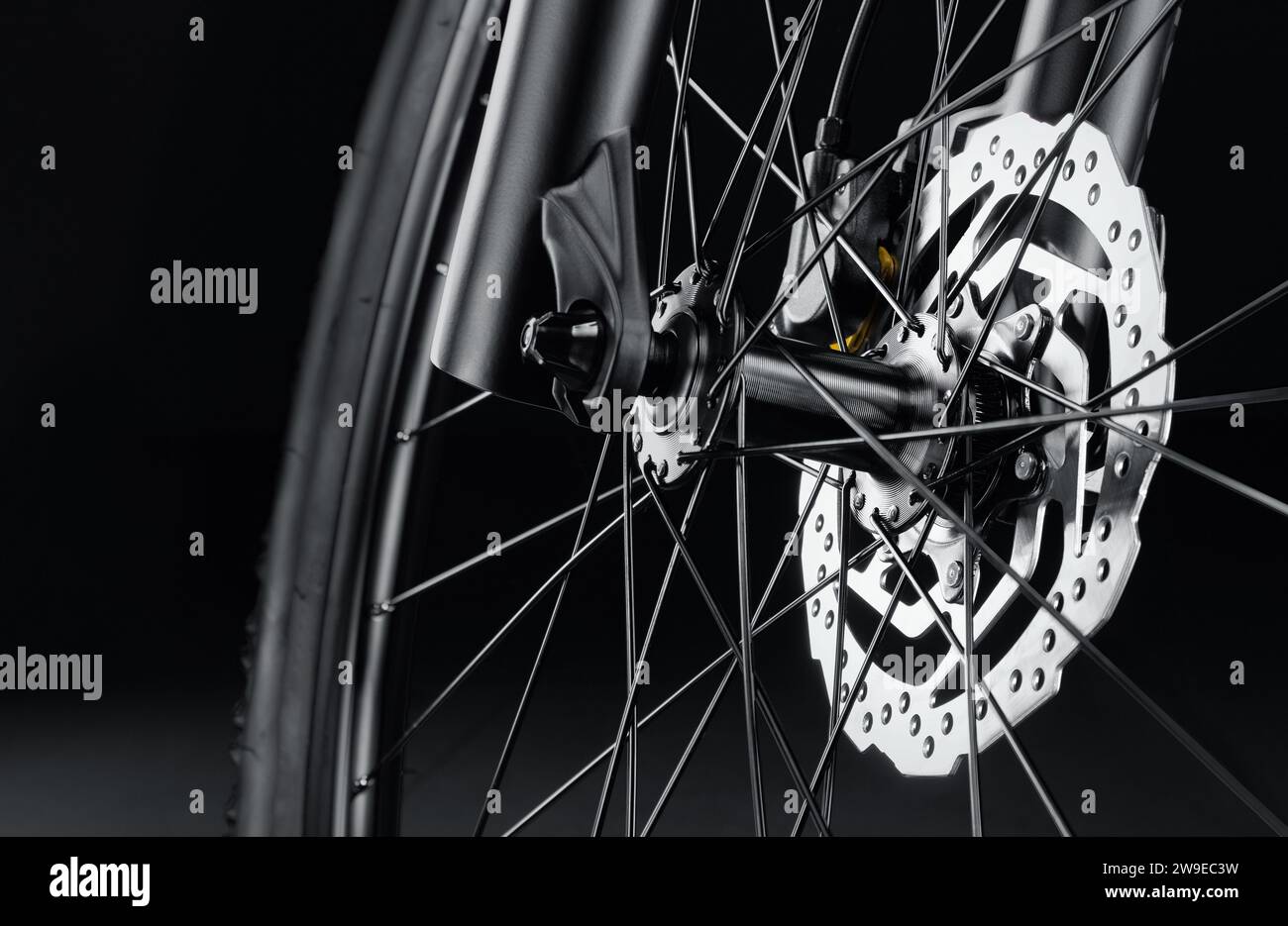 Disc brakes on a new bicycle close-up on a black background. Studio ...