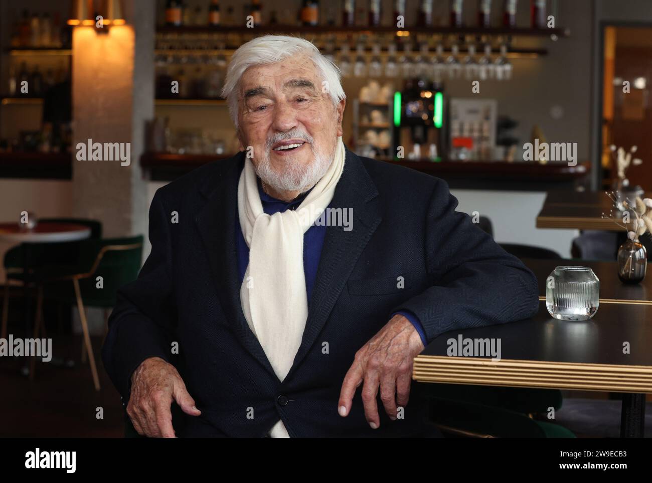 Munich, Germany. 10th Dec, 2023. Mario Adorf, actor, sits before the ...