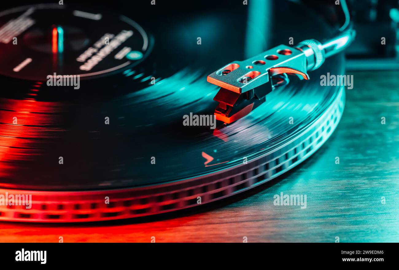 Colored neon vinyl record playing. Fusion of retro vibes and vibrant ...