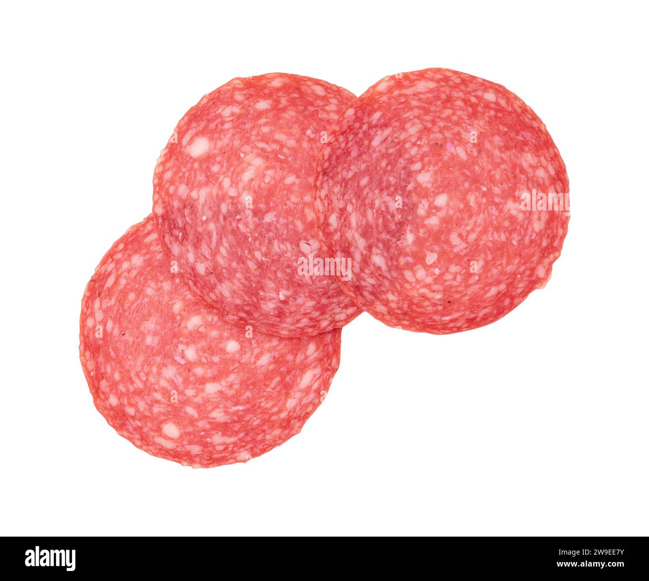 three pieces of sliced salami sausage laid out to create layout, salami sausage slices isolated ...