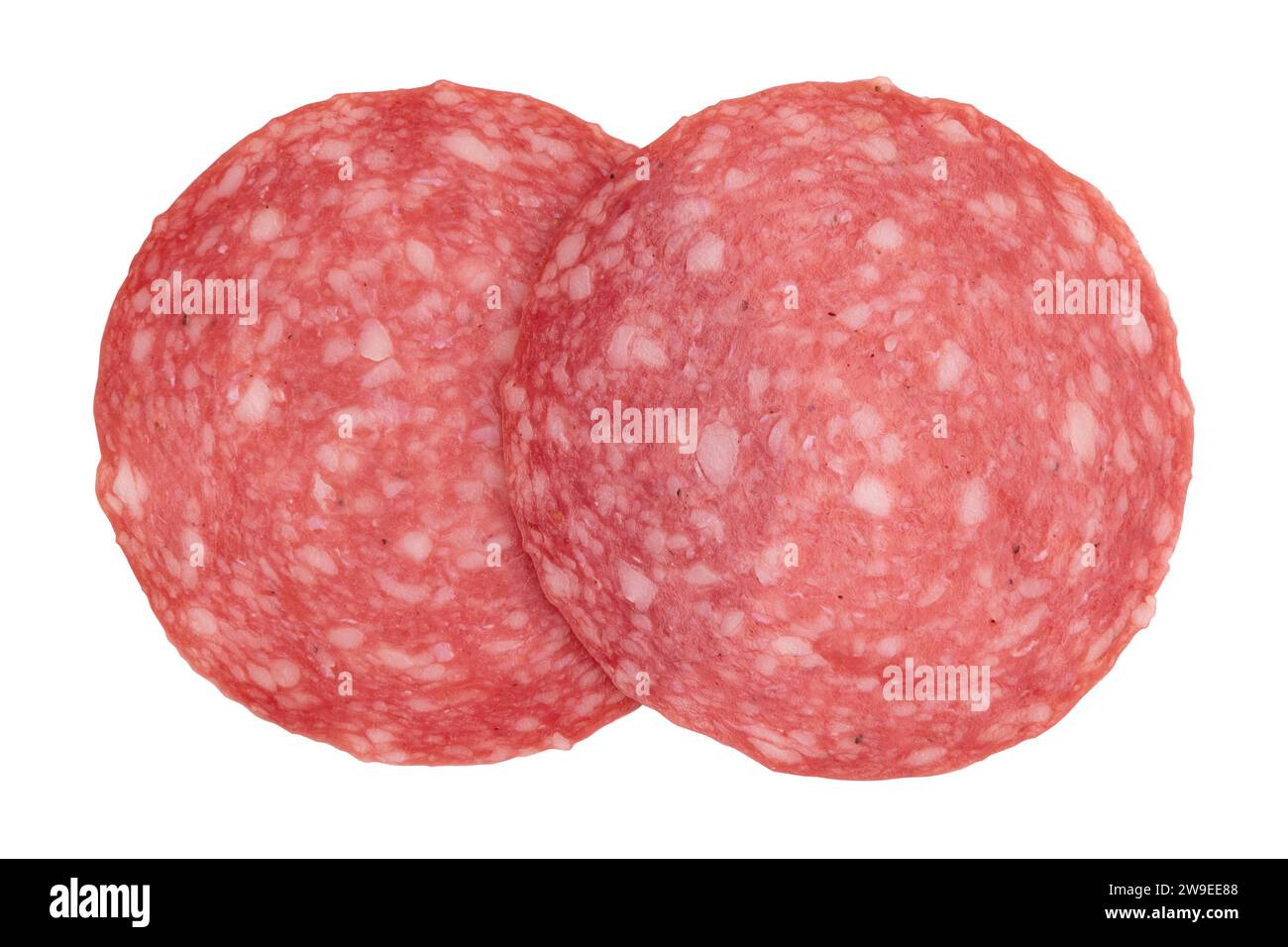 two pieces of sliced salami sausage laid out to create layout, salami sausage slices isolated on ...