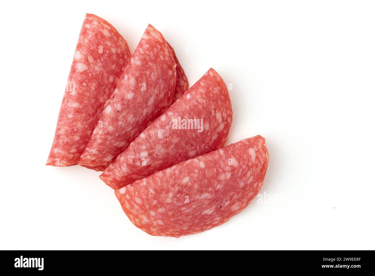 salami sausage slices isolated on white background, pieces of sliced salami sausage laid out to ...