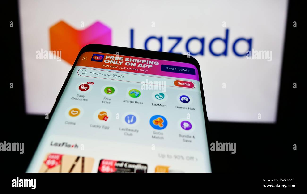 Smartphone with website of Asian e-commerce company Lazada Group in ...