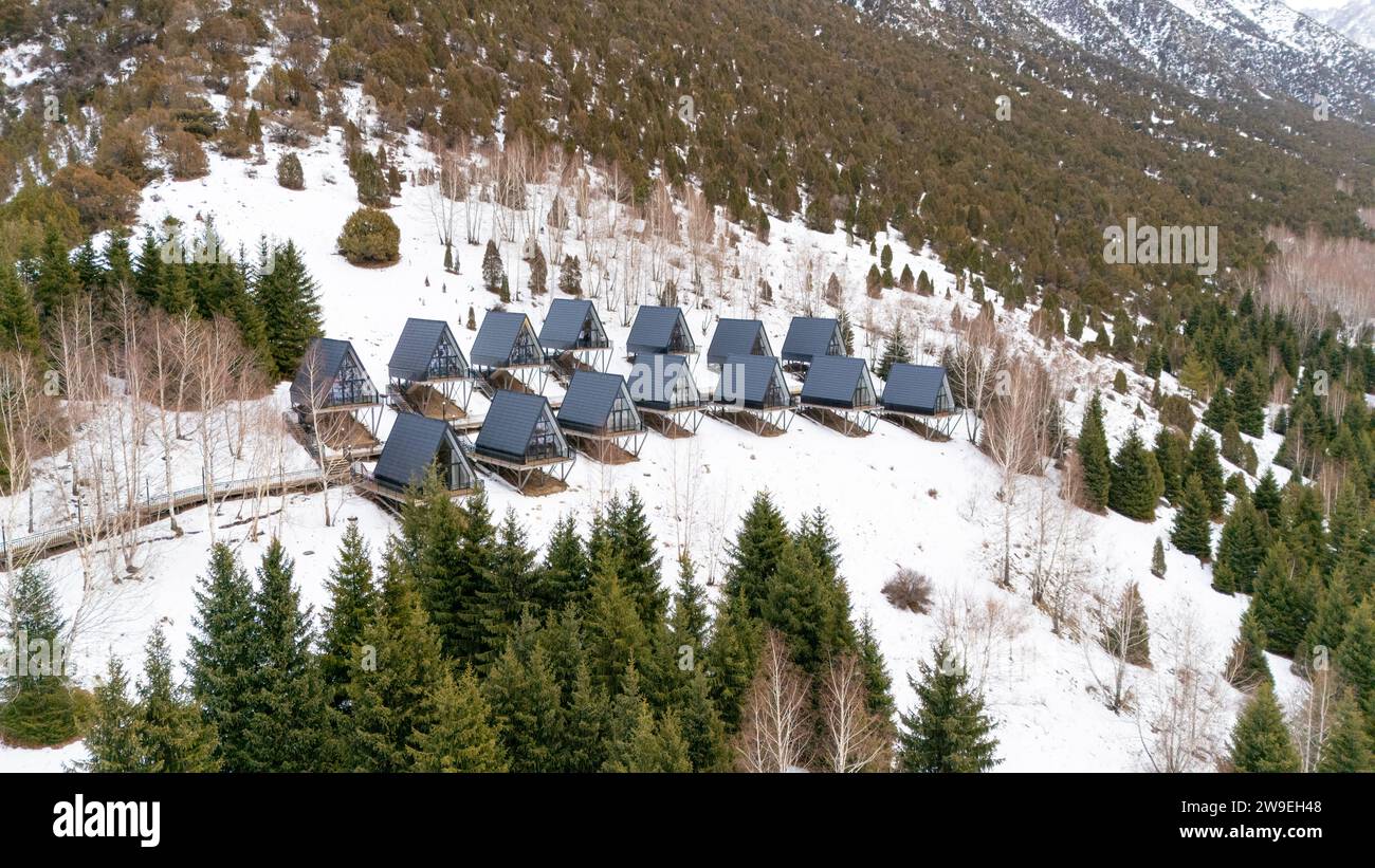 Aerial view of A Frame cabins on hill in the winter park Stock Photo ...
