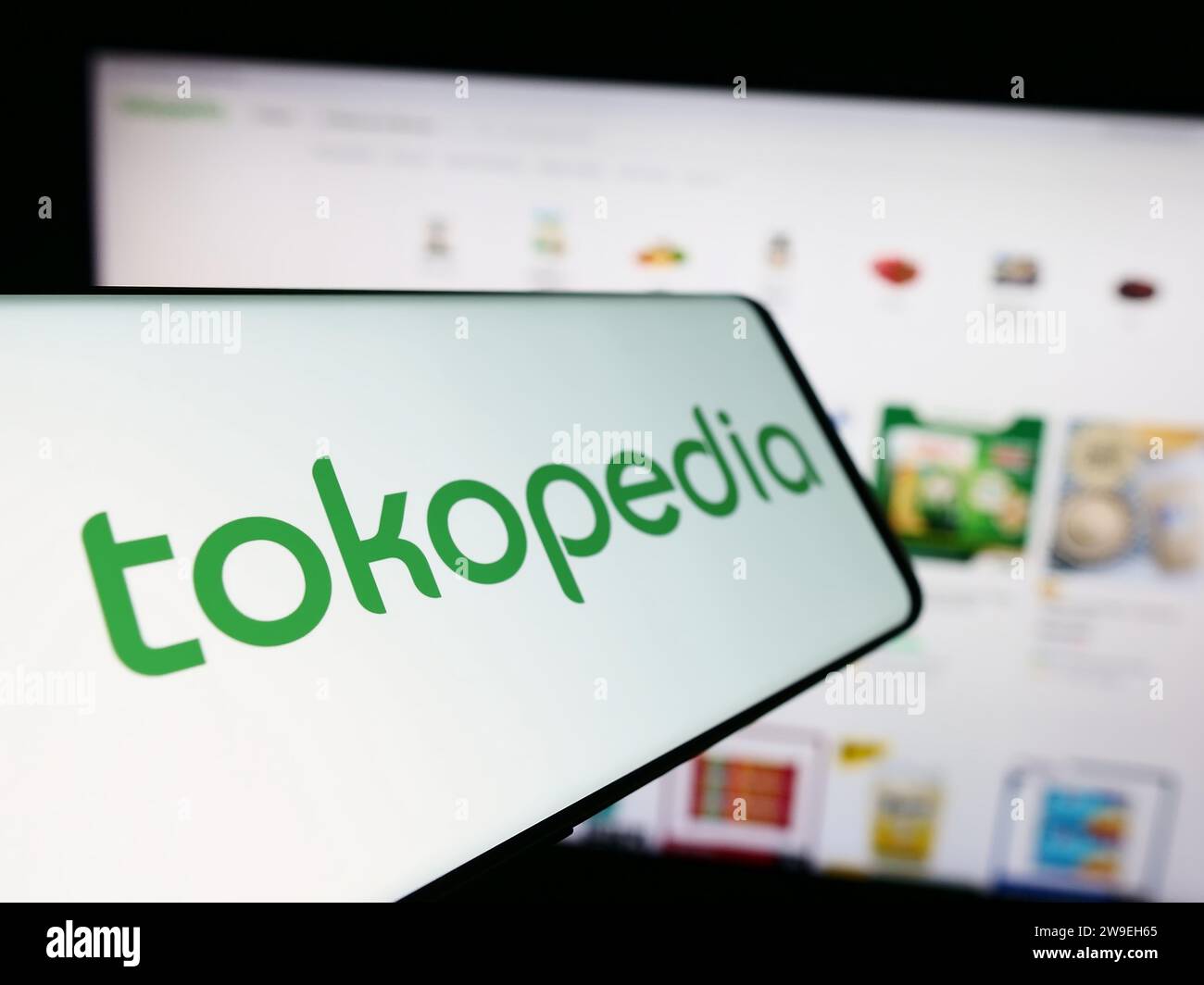 Smartphone with logo of Indonesian e-commerce company PT Tokopedia in ...
