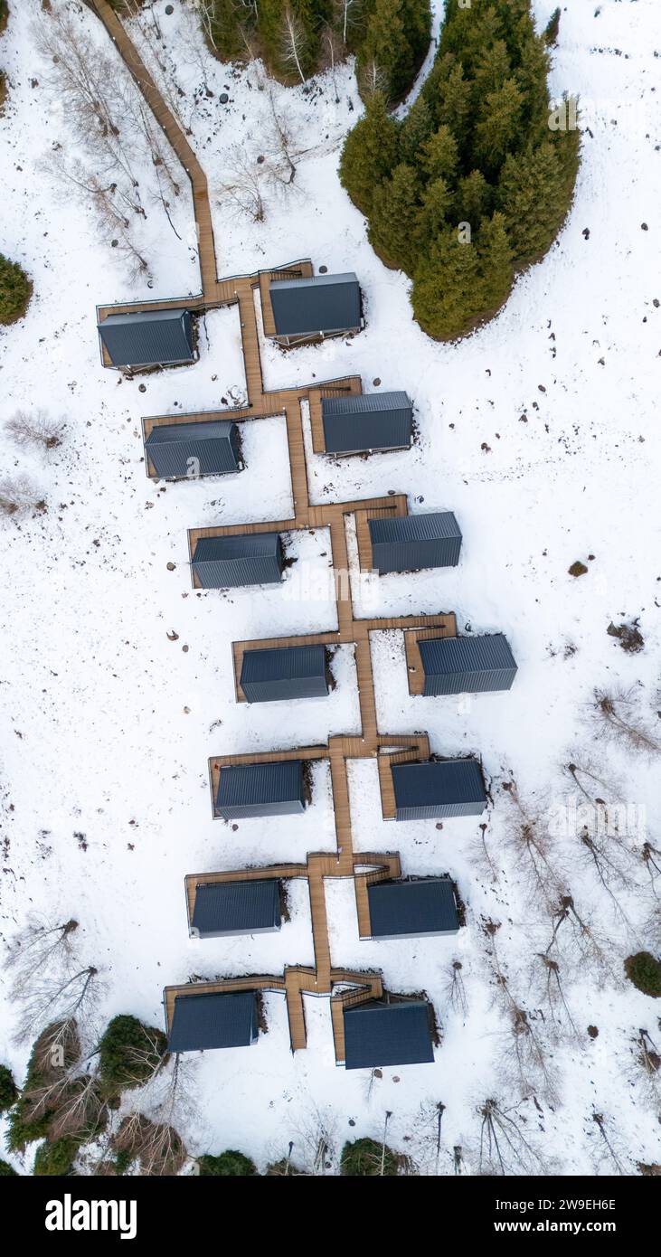 Aerial view of A Frame cabins on hill in the winter park Stock Photo ...