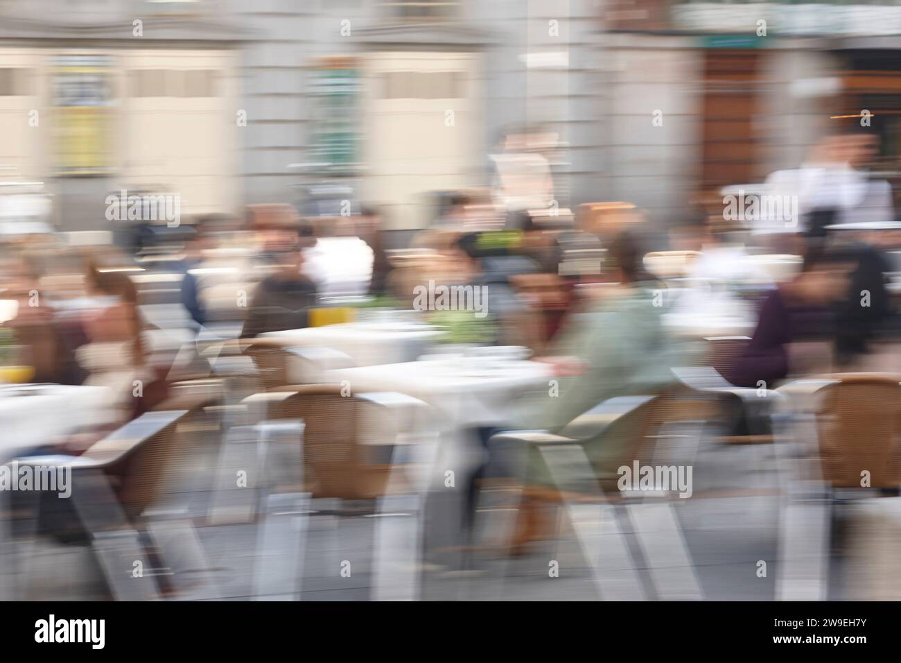 Motion effect in photography. Slow time exposure. Outdoor restaurant ...