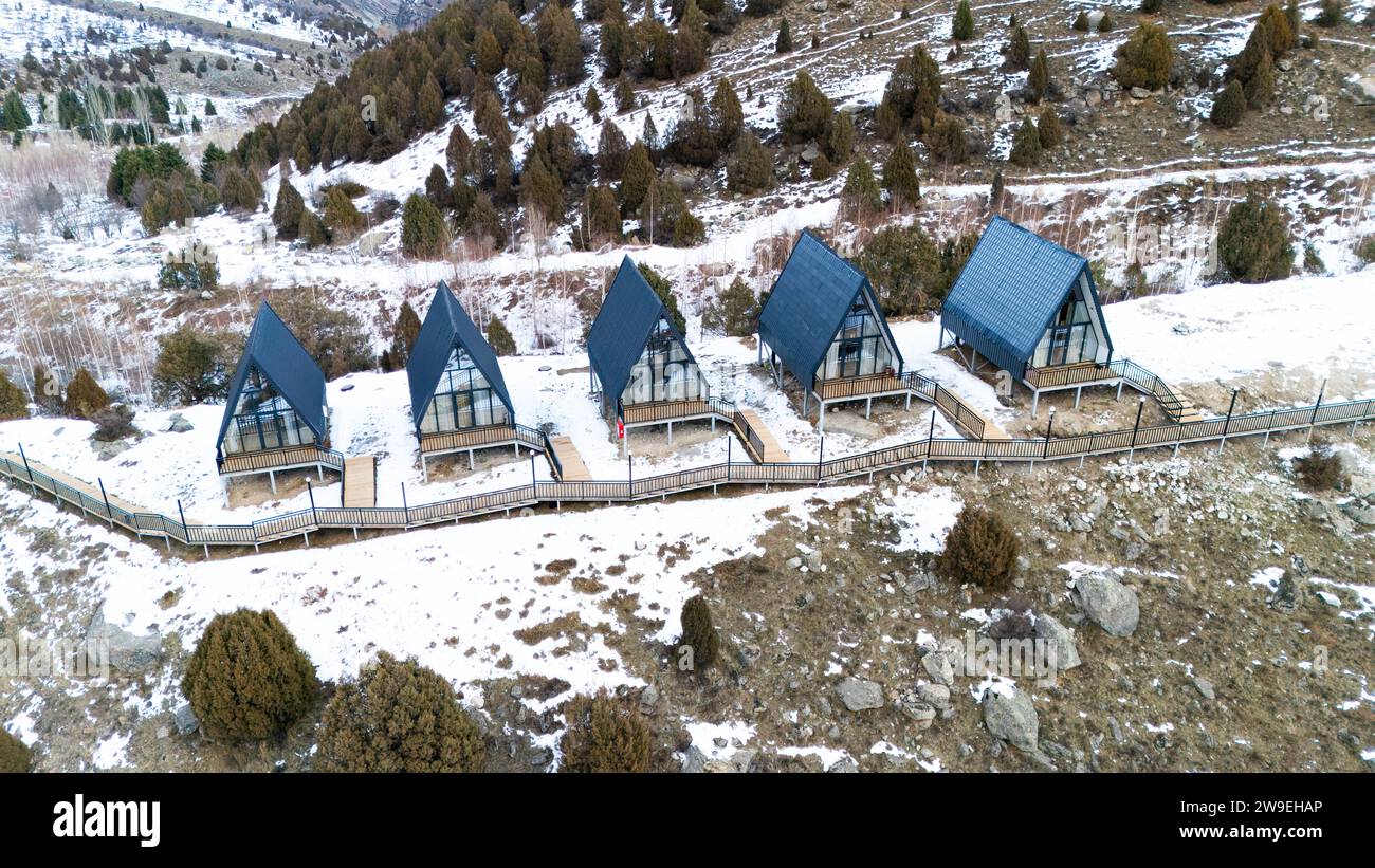 Aerial view of A Frame cabins on hill in the winter park Stock Photo ...