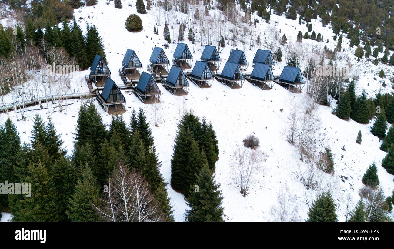 Aerial view of A Frame cabins on hill in the winter park Stock Photo ...