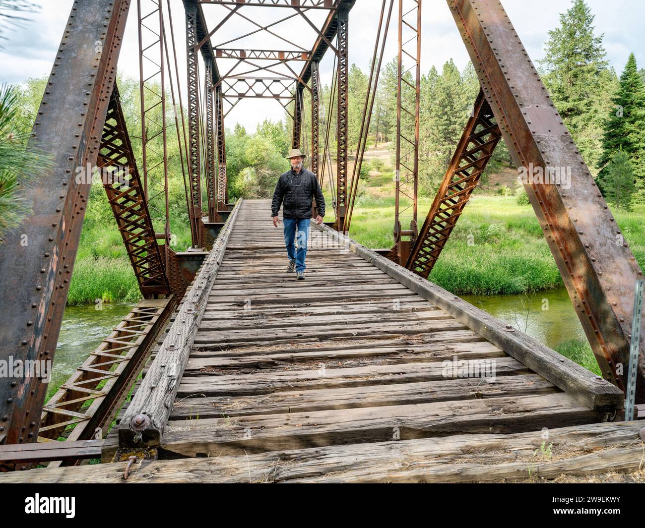 Man walking on metal bridge hi-res stock photography and images - Alamy