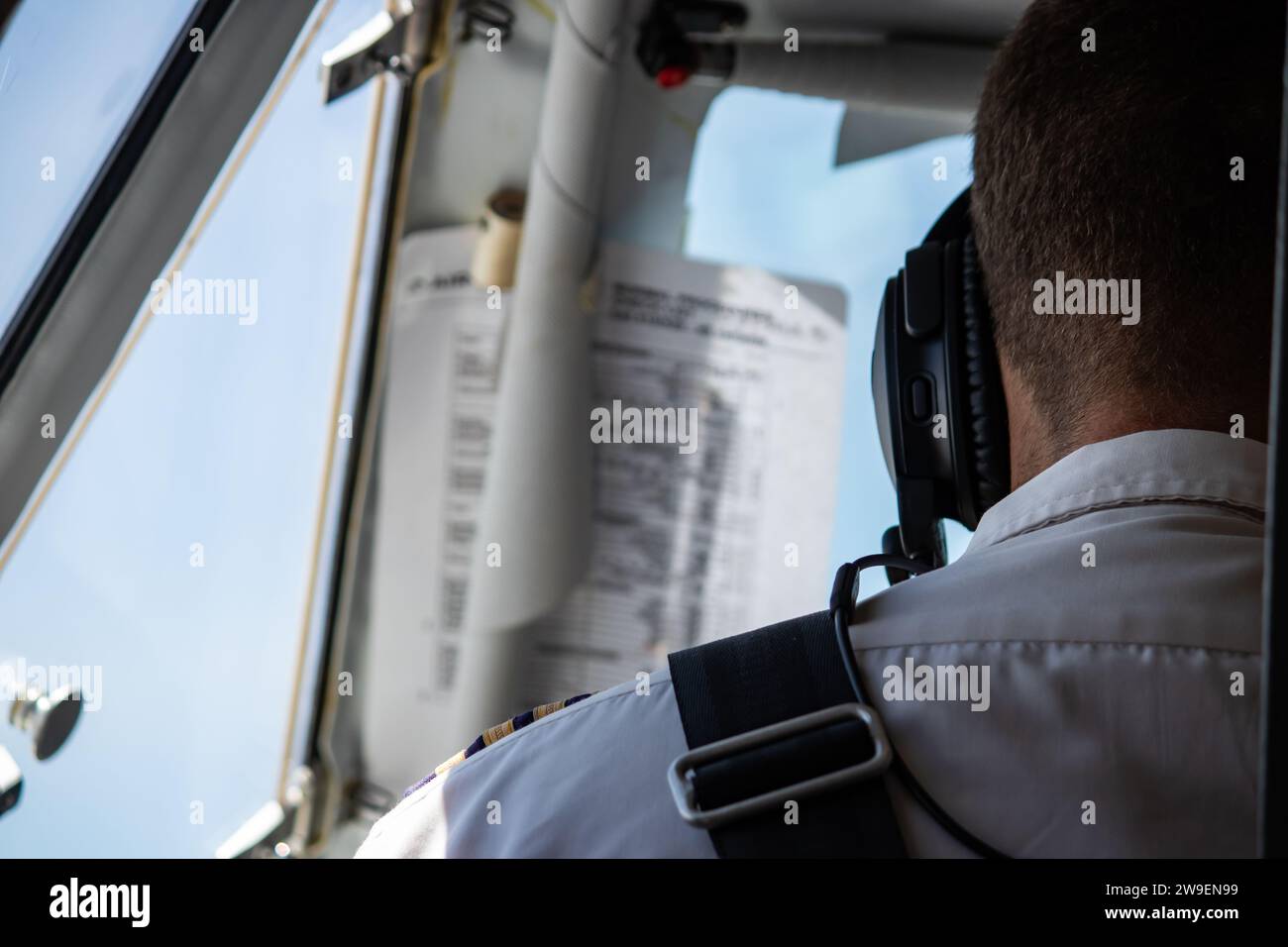 Contour of helicopter pilot flying over Africa, delivering humanitarian ...